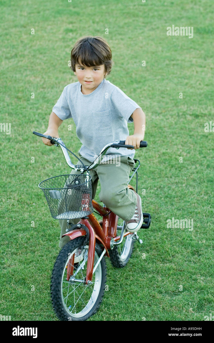 Boy on bike, full length Stock Photo - Alamy