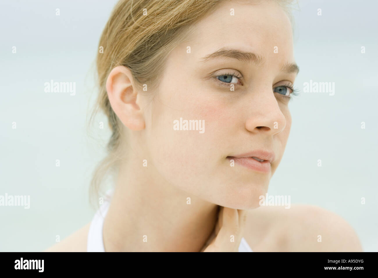 Young woman, head and shoulders, portrait, sea in background Stock ...