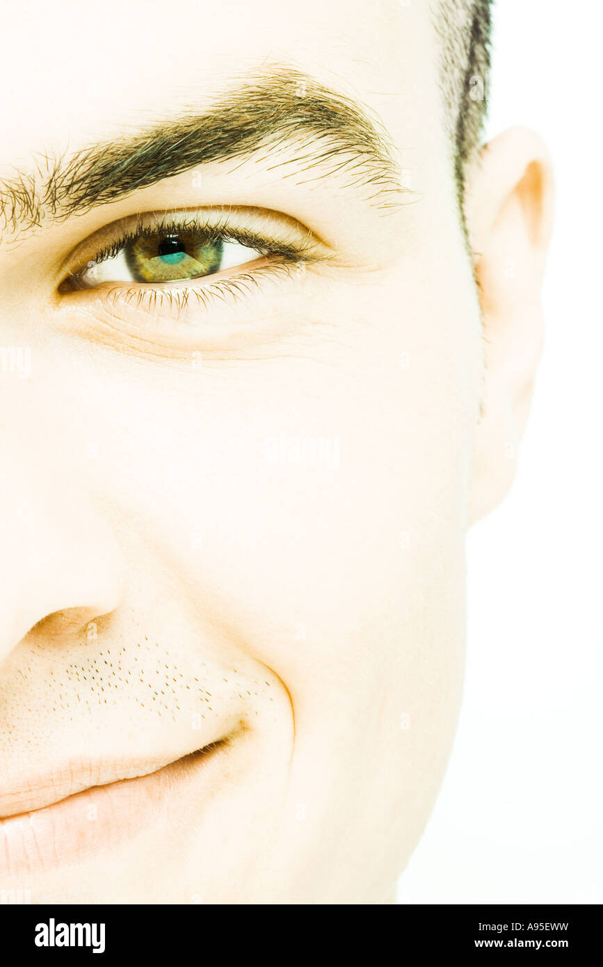 Young man's face, extreme close-up, cropped front view Stock Photo - Alamy