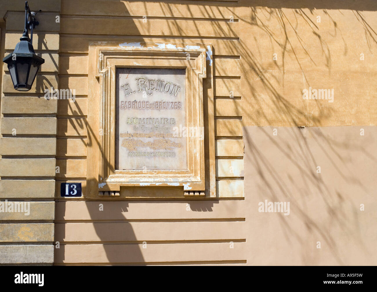 Shop sign on wall Stock Photo - Alamy