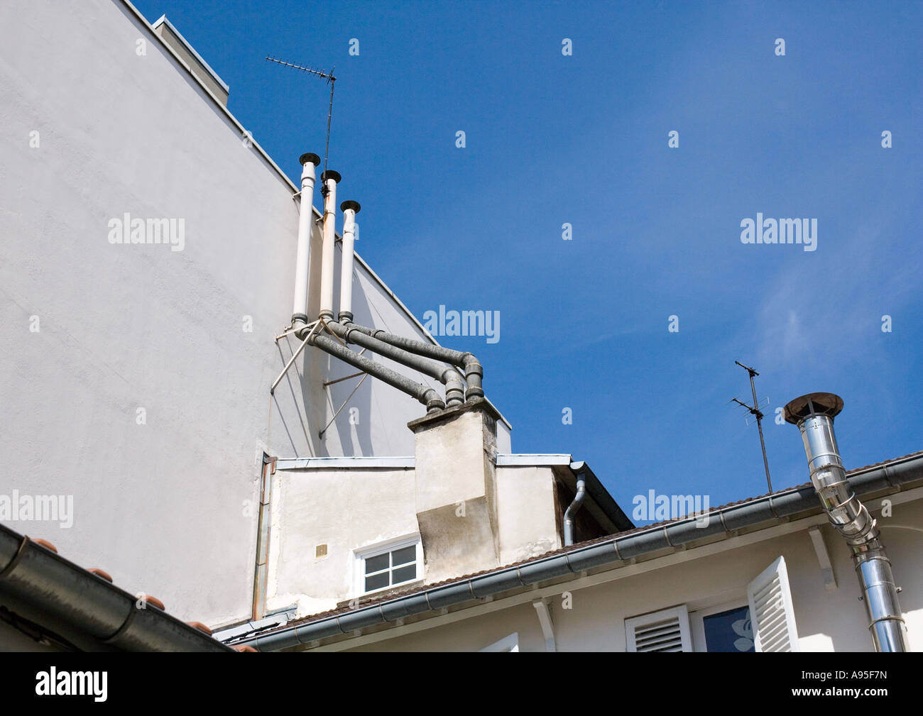 Air ducts emerging from apartment building Stock Photo - Alamy