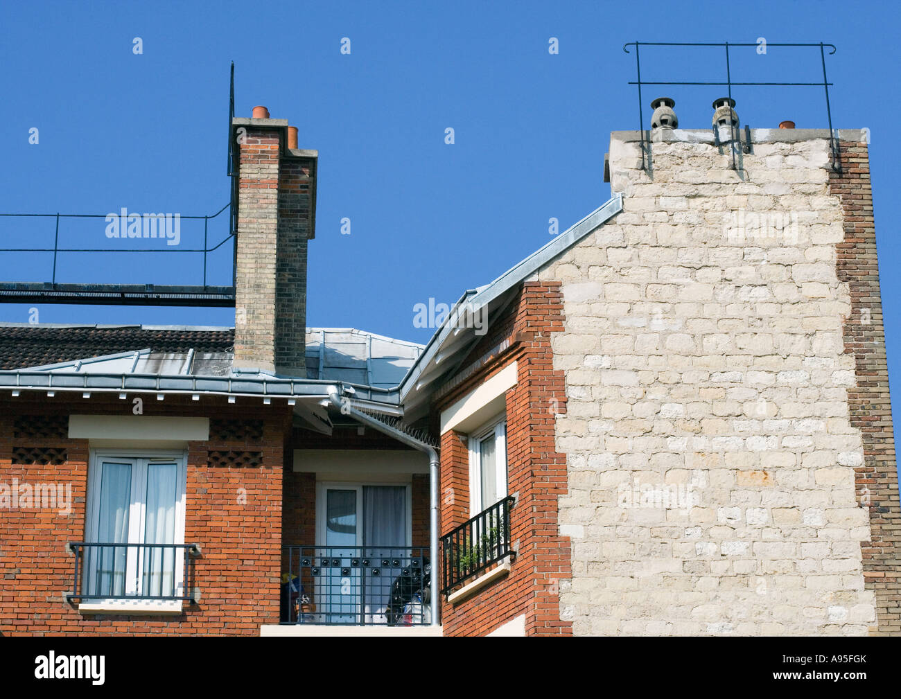 Brick apartment building with chimneys hi-res stock photography and ...