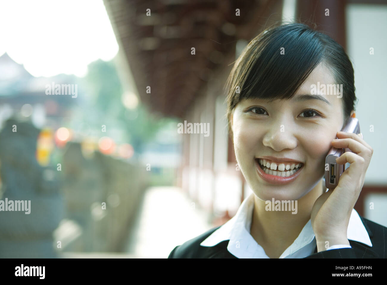 Young woman using cell phone, close-up Stock Photo - Alamy