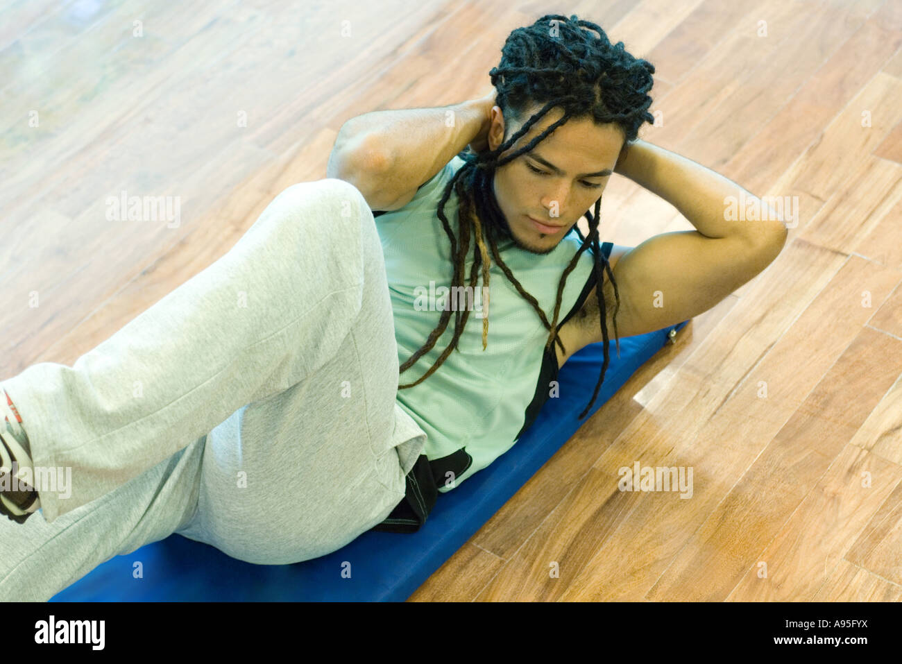 Man doing sit-ups Stock Photo - Alamy