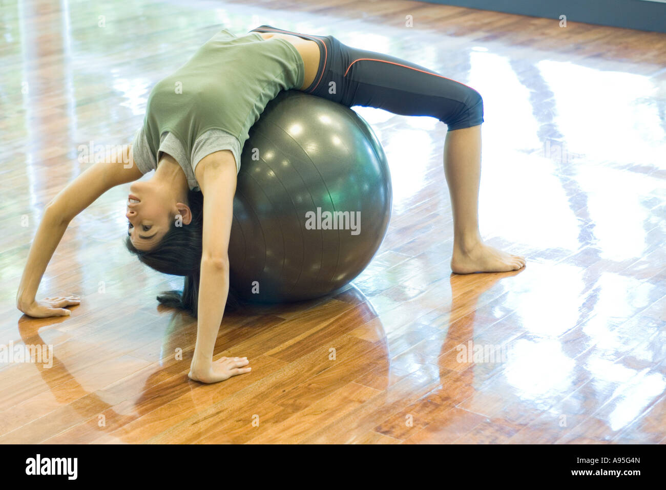 Young woman doing backbend on fitness ball Stock Photo - Alamy