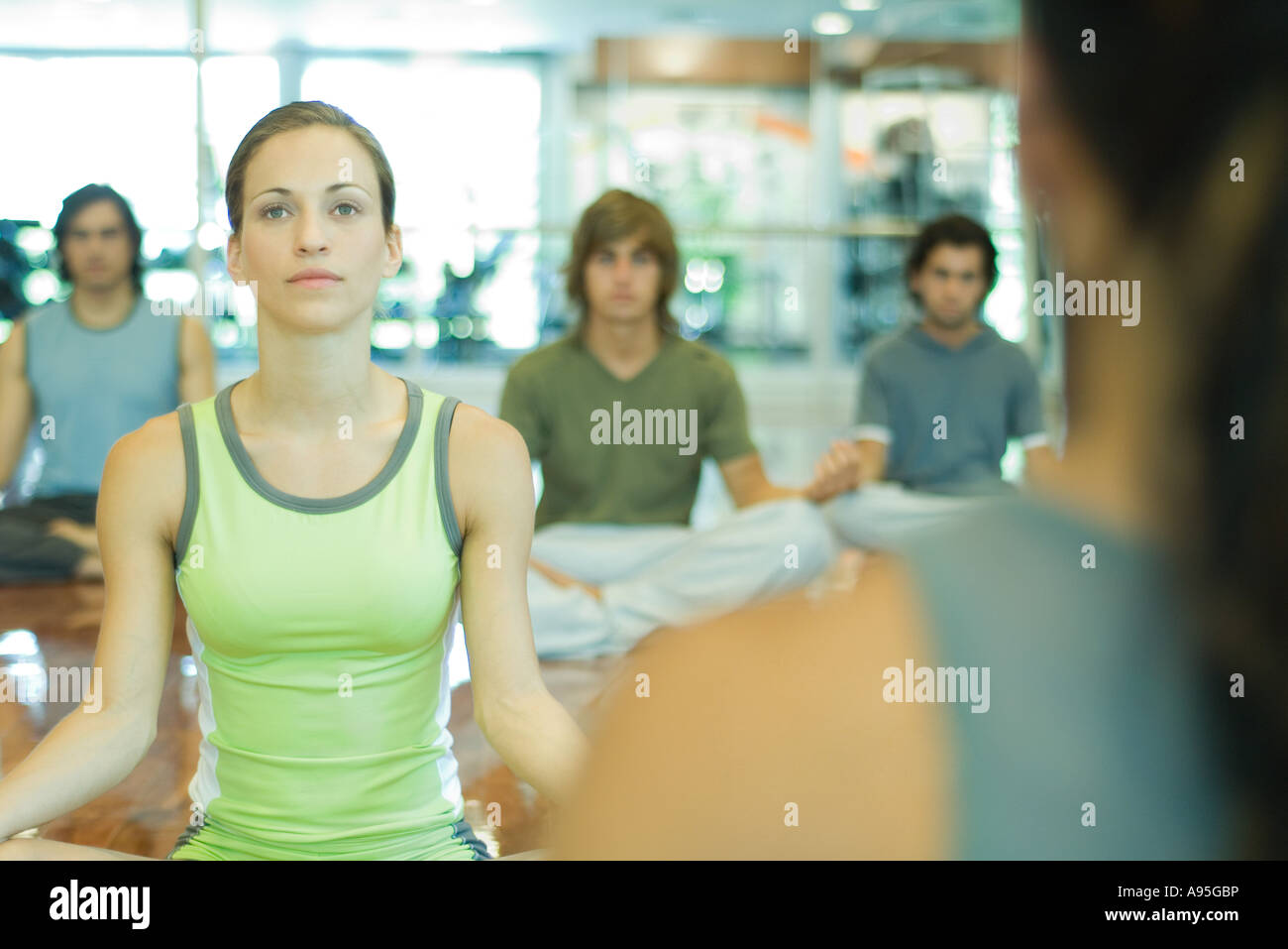 Exercise class sitting in yoga position Stock Photo - Alamy