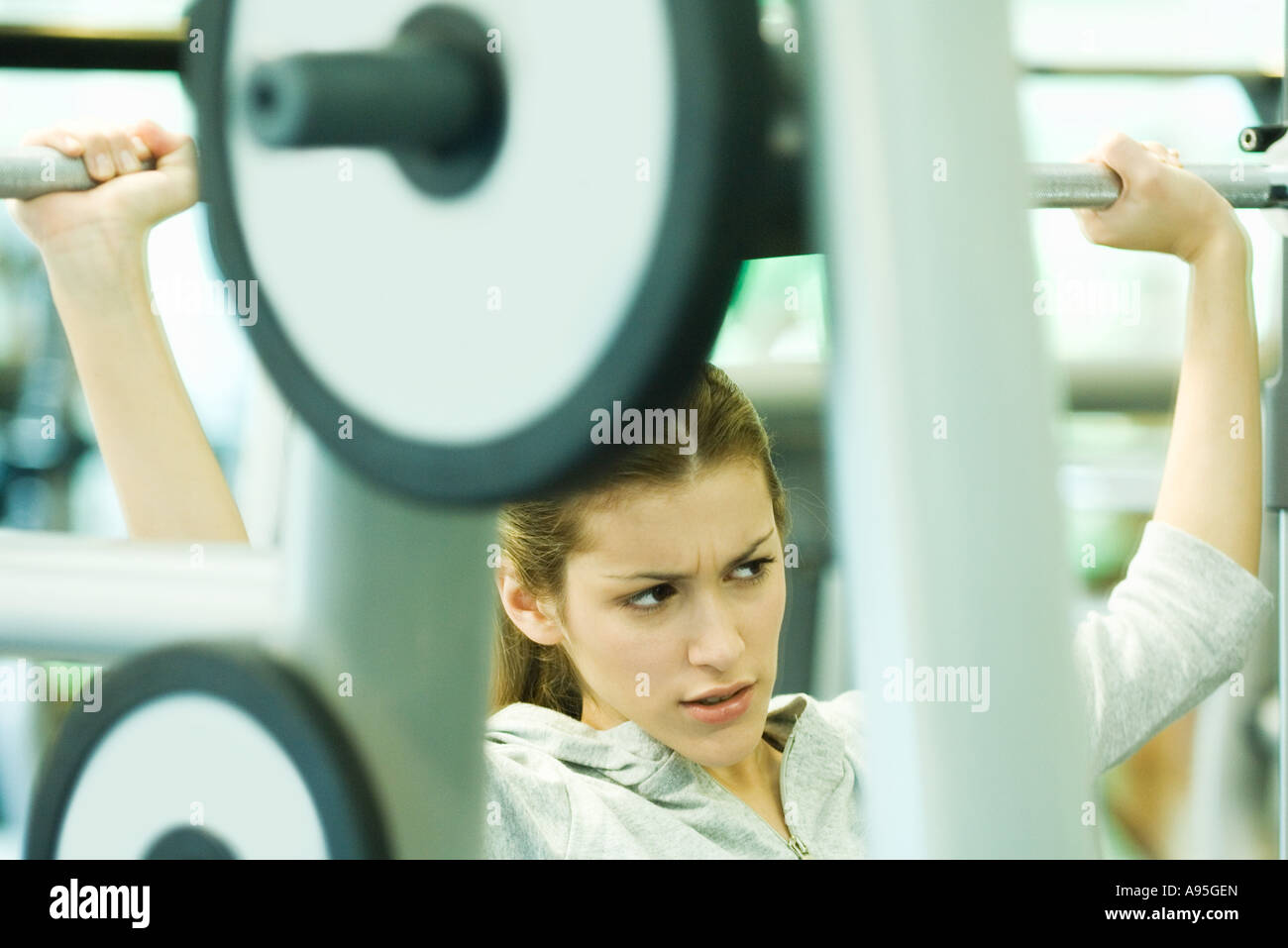 Woman lifting weights Stock Photo - Alamy