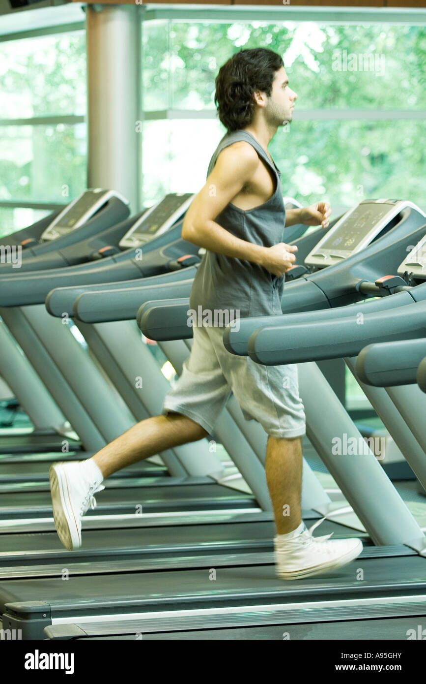Man running on treadmill Stock Photo - Alamy