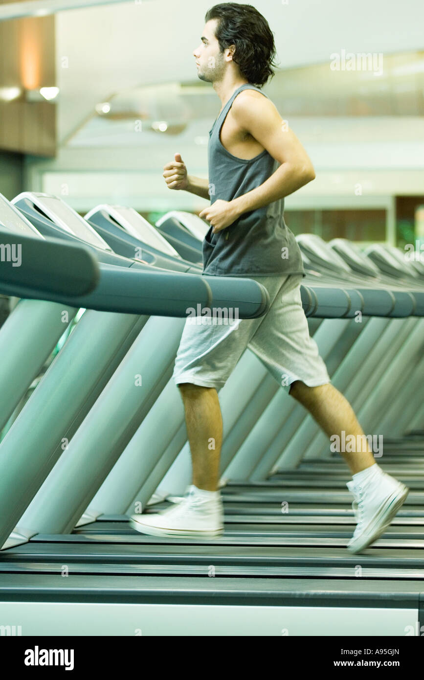 Man running on treadmill Stock Photo - Alamy