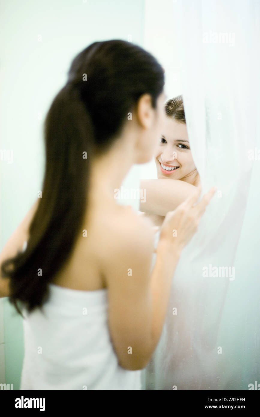 Woman taking shower through hi-res stock photography and images - Alamy