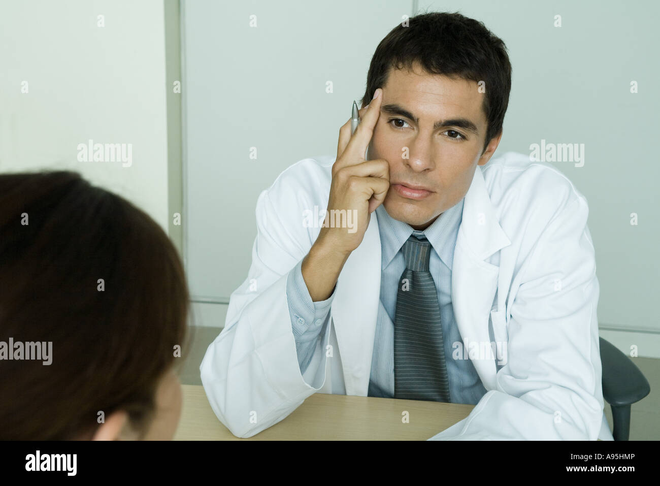 Woman patient doctor sit across hi-res stock photography and images - Alamy