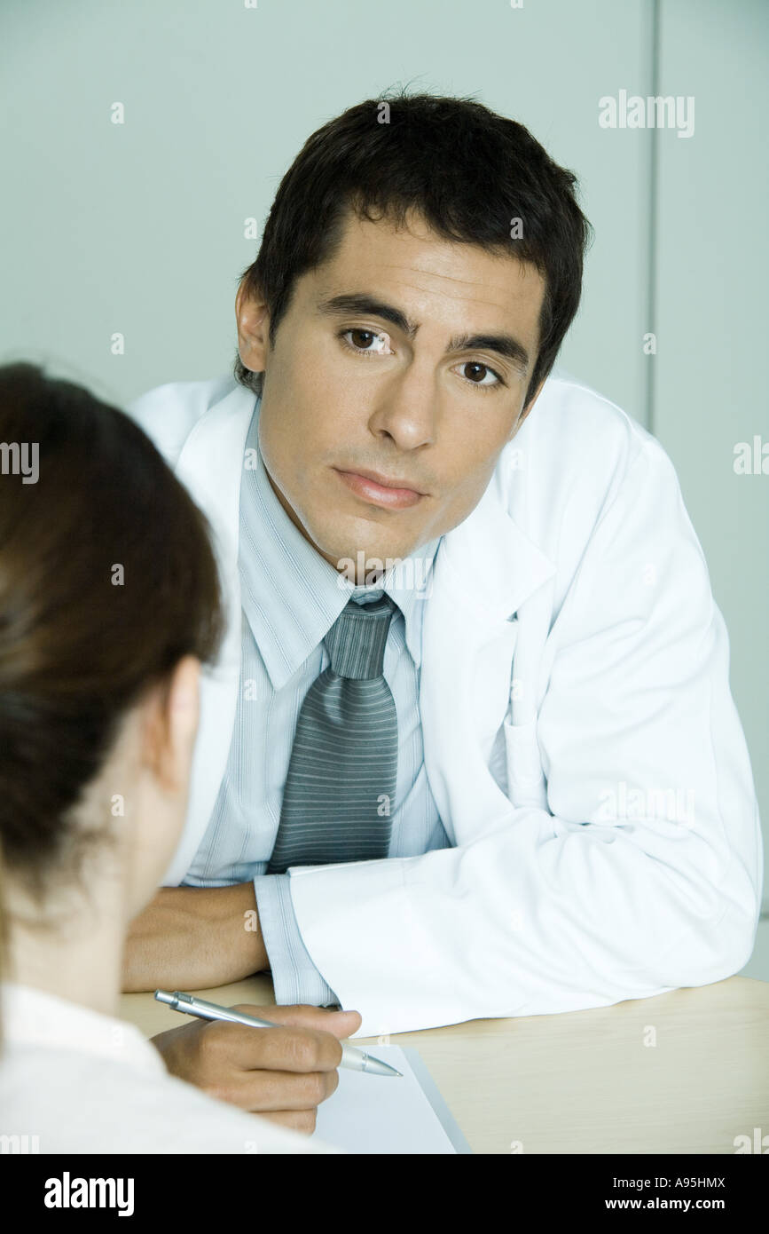 Two men sitting across the desk hi-res stock photography and images - Alamy