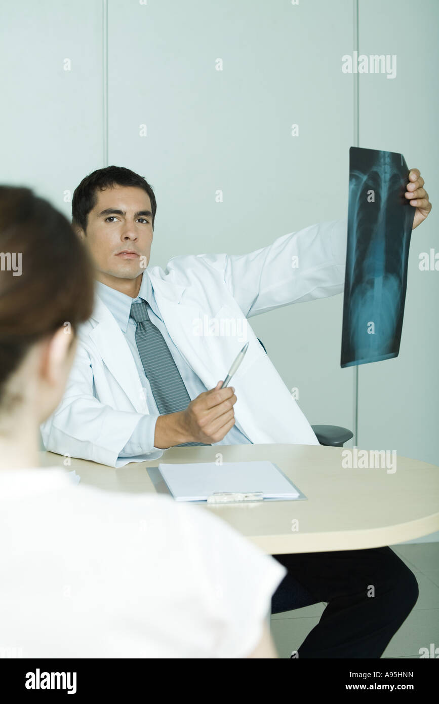 Woman patient doctor sit across hi-res stock photography and images - Alamy