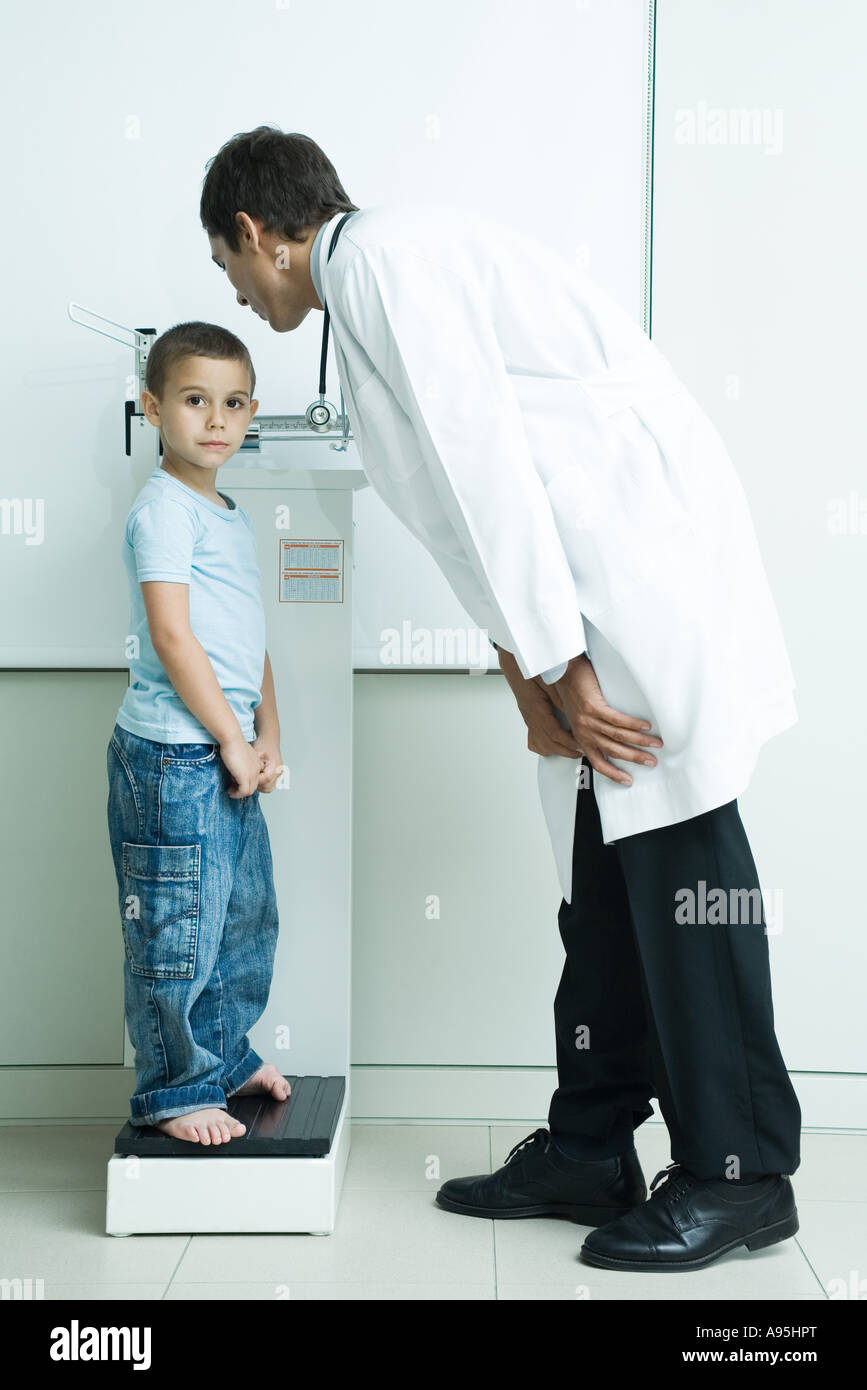 Child on weighing scales hi-res stock photography and images - Alamy
