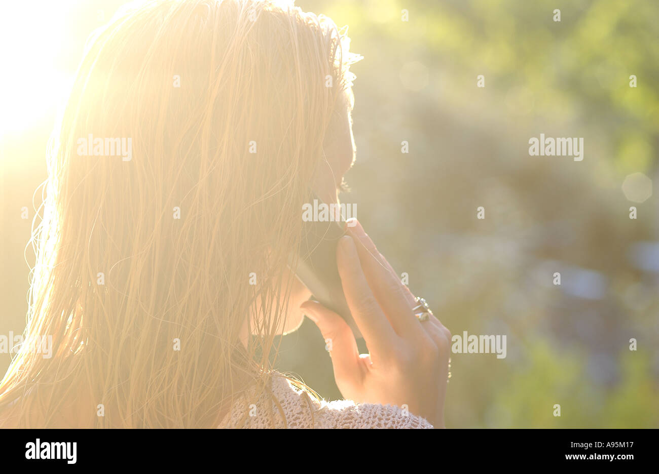 Young woman making a call on a mobile (cell) phone Stock Photo - Alamy