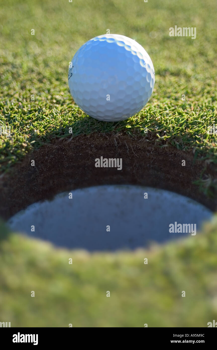 Golf ball falling hole hi-res stock photography and images - Alamy