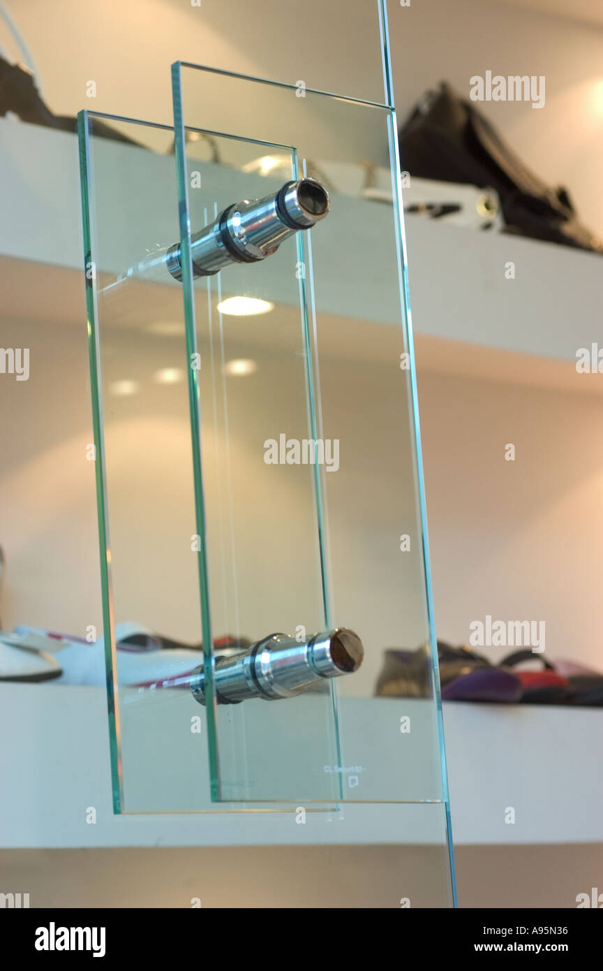 A glass door inside a shoe store Stock Photo - Alamy