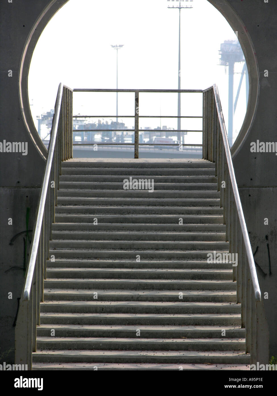 A staircase leading to a circular window Stock Photo - Alamy