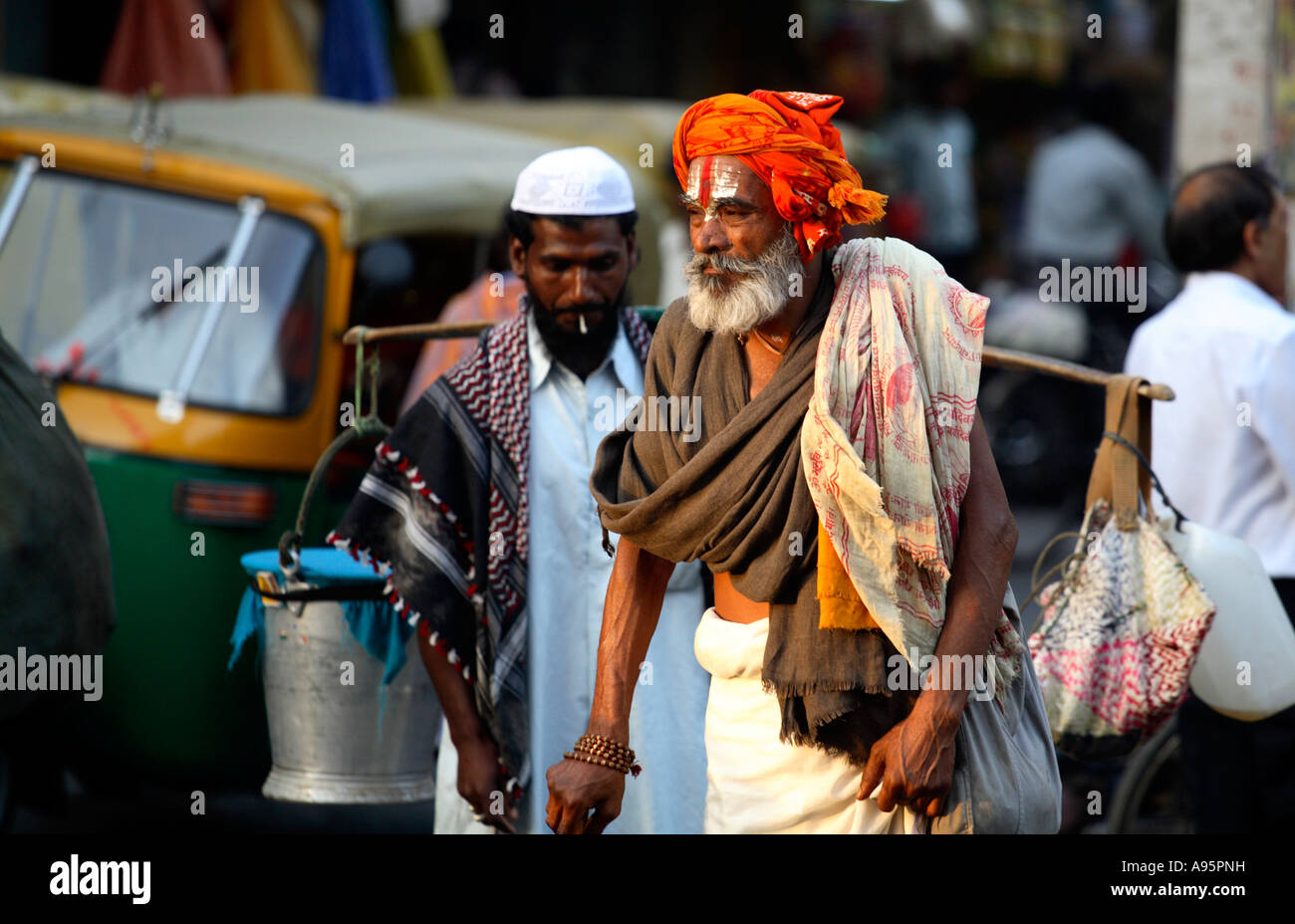 Indian sadhu walking through Ahmedabad, Gujarat, India Stock Photo - Alamy
