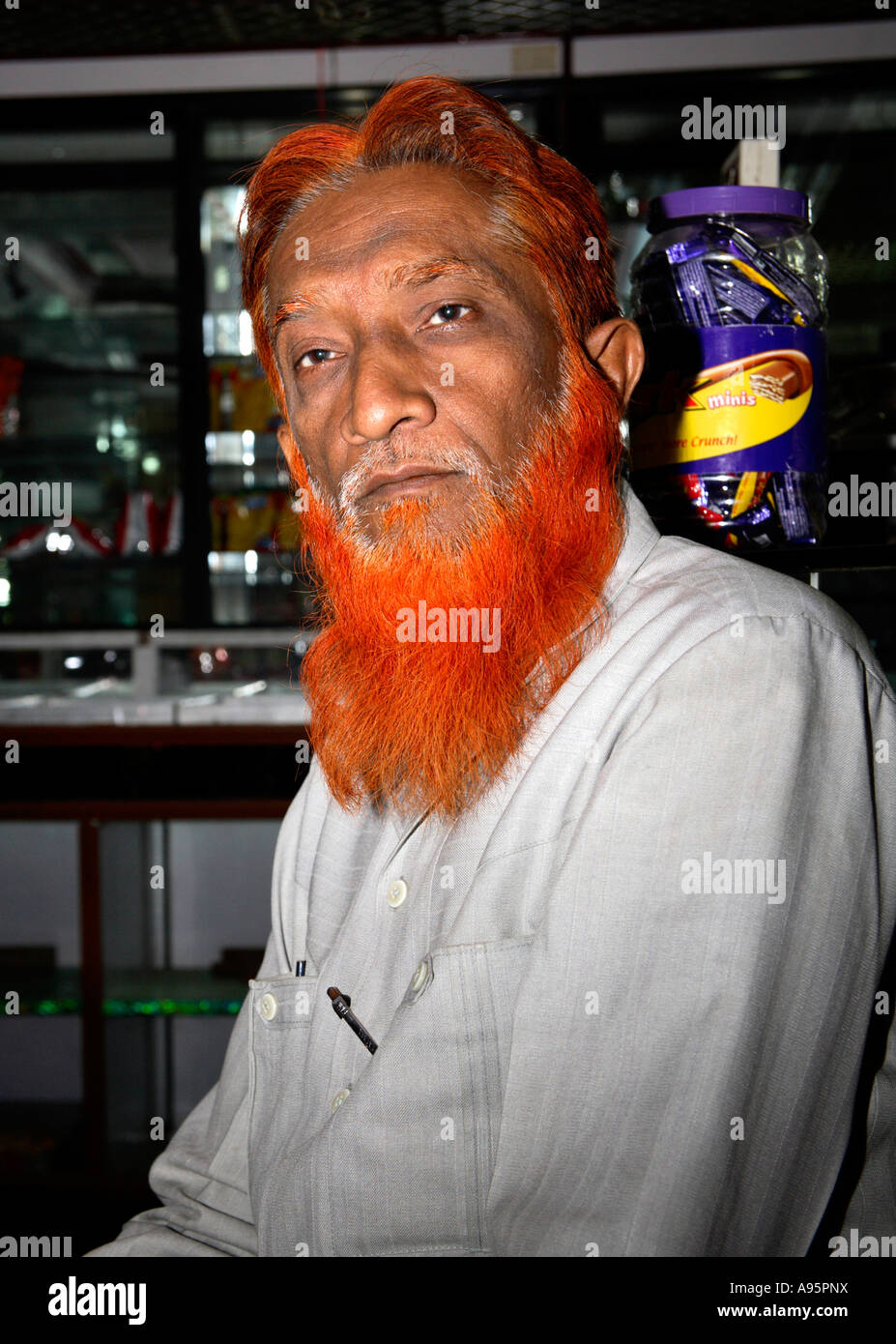 Muslim Indian shopkeeper with orange beard and hair, Ahmedabad, Gujarat ...