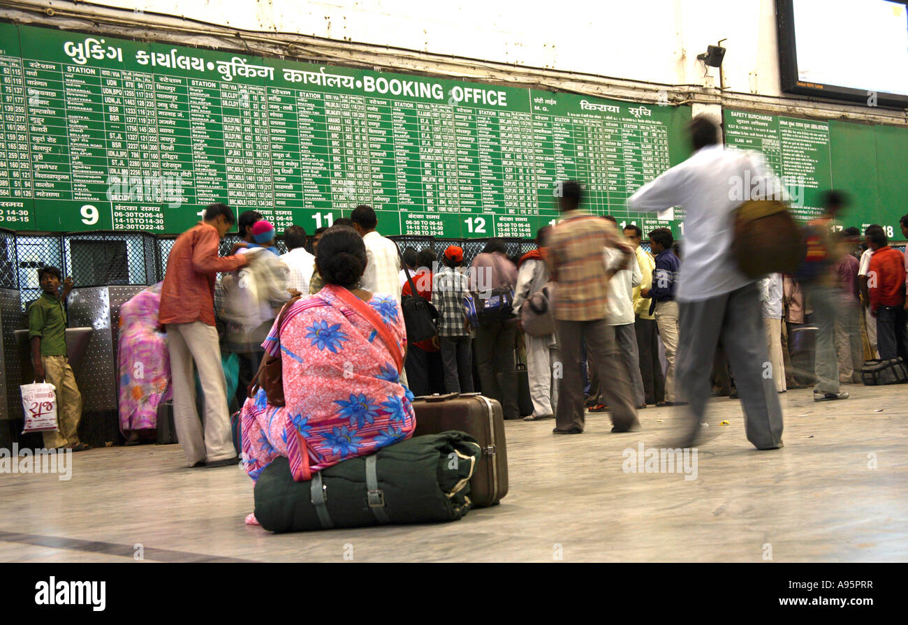 Indian passengers waiting at Railway Station, Ahmedabad, Gujarat, India ...