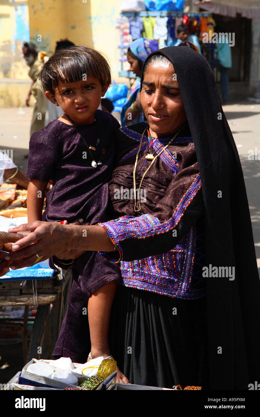 Female and child of the Rabari tribe in market at Anjar, Gujarat, India ...
