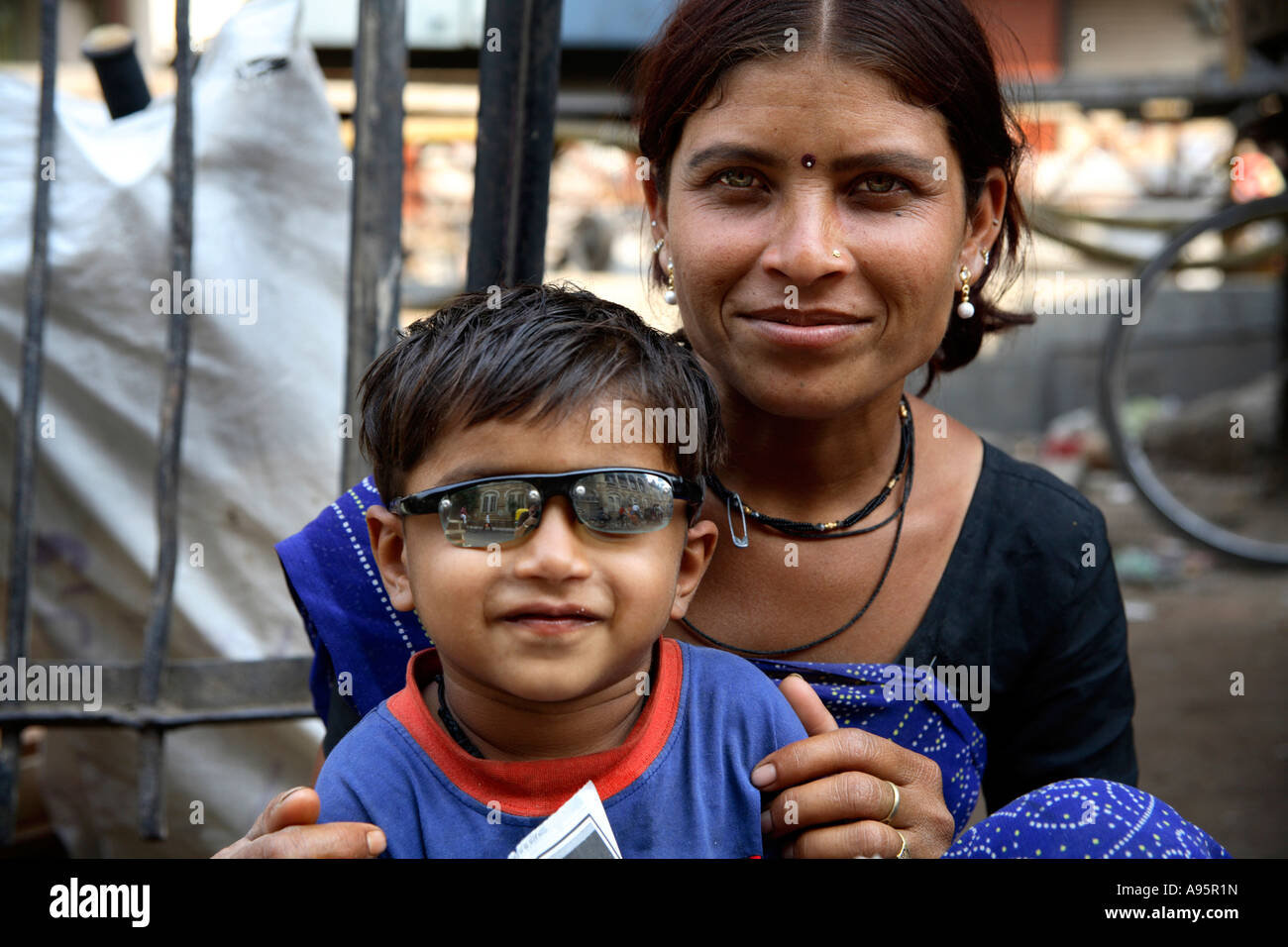 Female Indian Trader posing with her young son, Vadodara, Gujarat ...