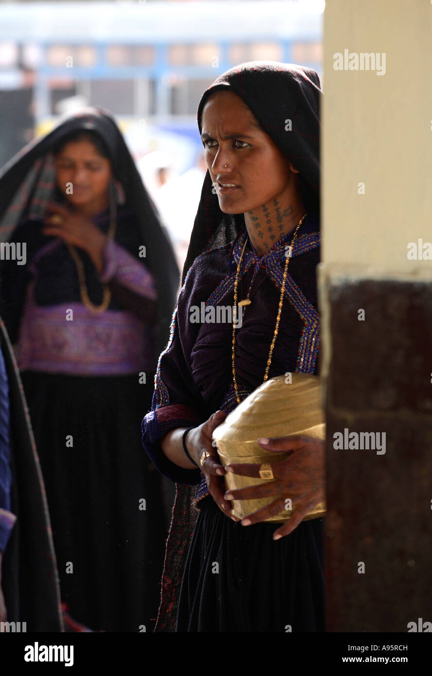 Rabari tribal women with neck tattoos at Bhuj bus-stand, Kutch district ...
