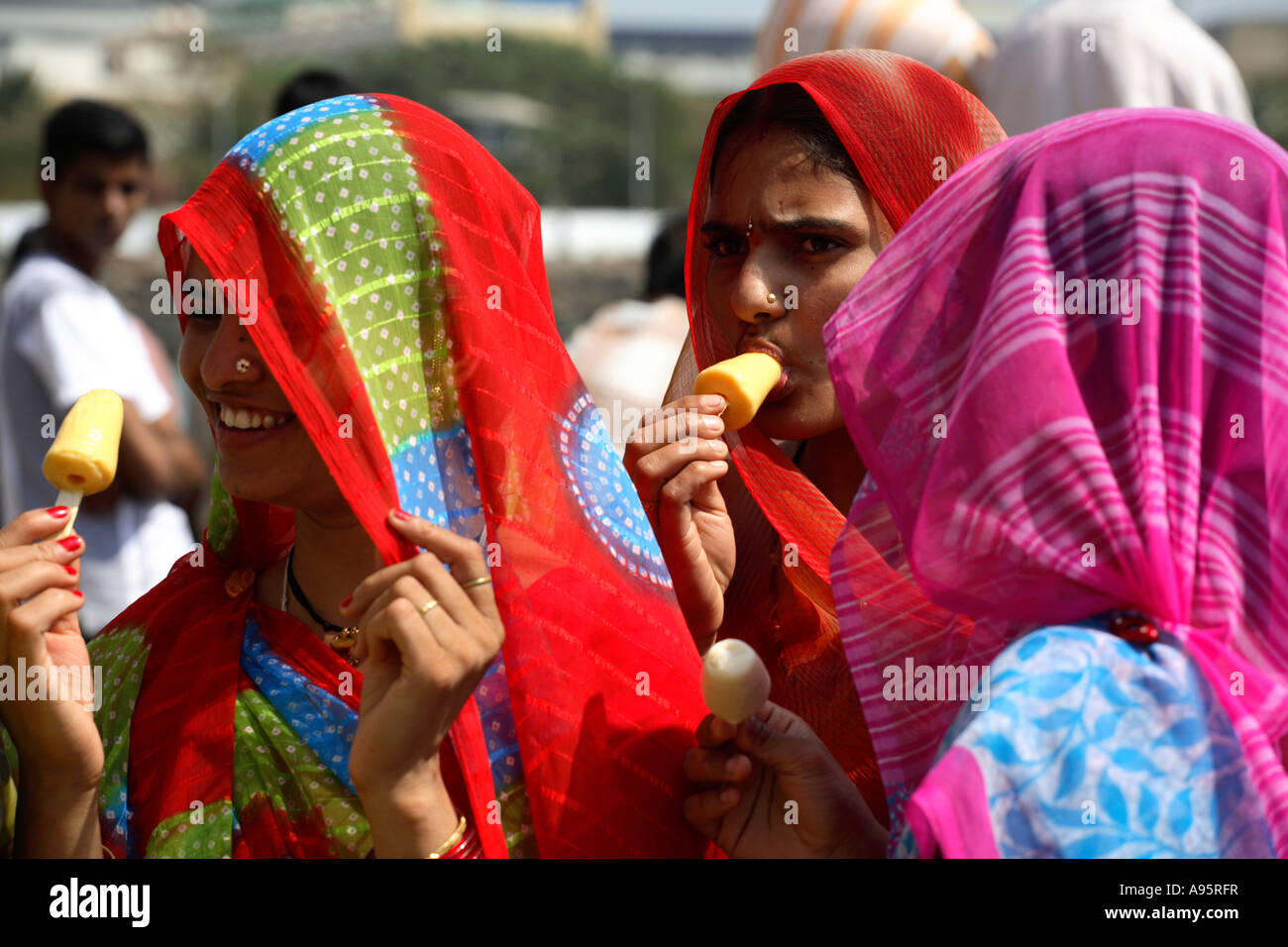 Indian females eating ice-creams, Mumbai, India Stock Photo - Alamy