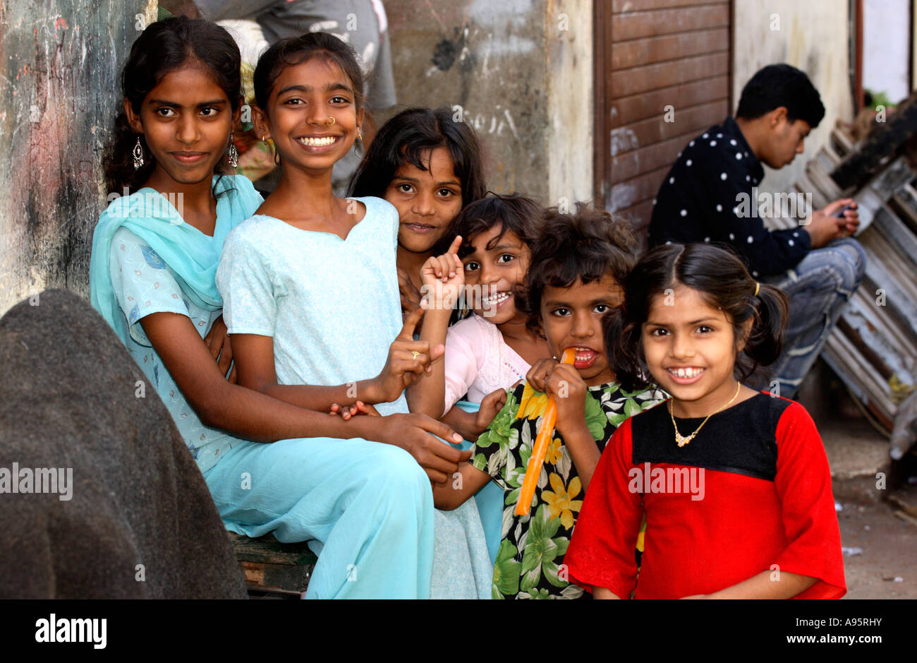 Six young Indian females posing happily in the street, Mumbai, India ...