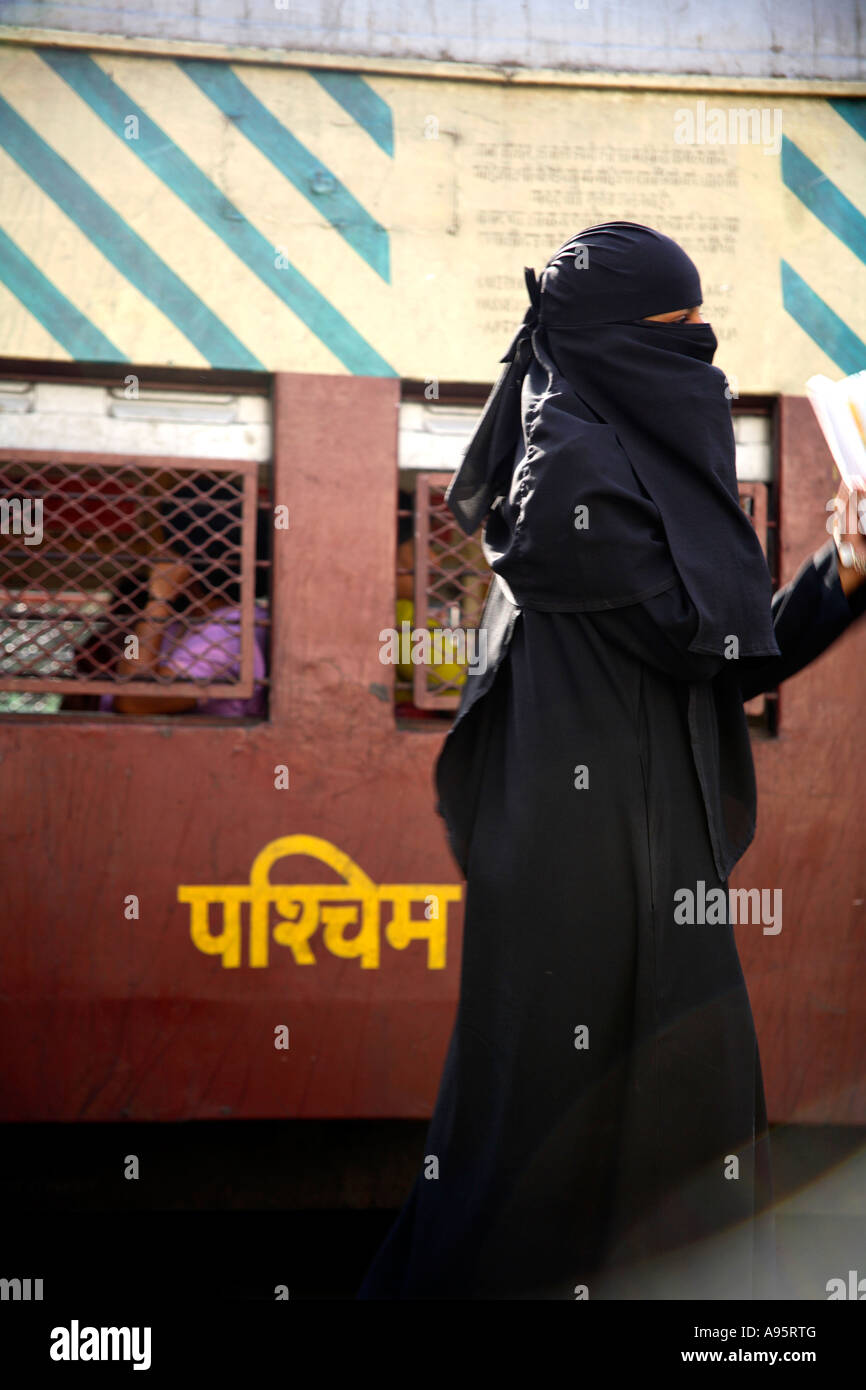 Indian Muslim woman wearing niqab at railway station, Mumbai, India ...