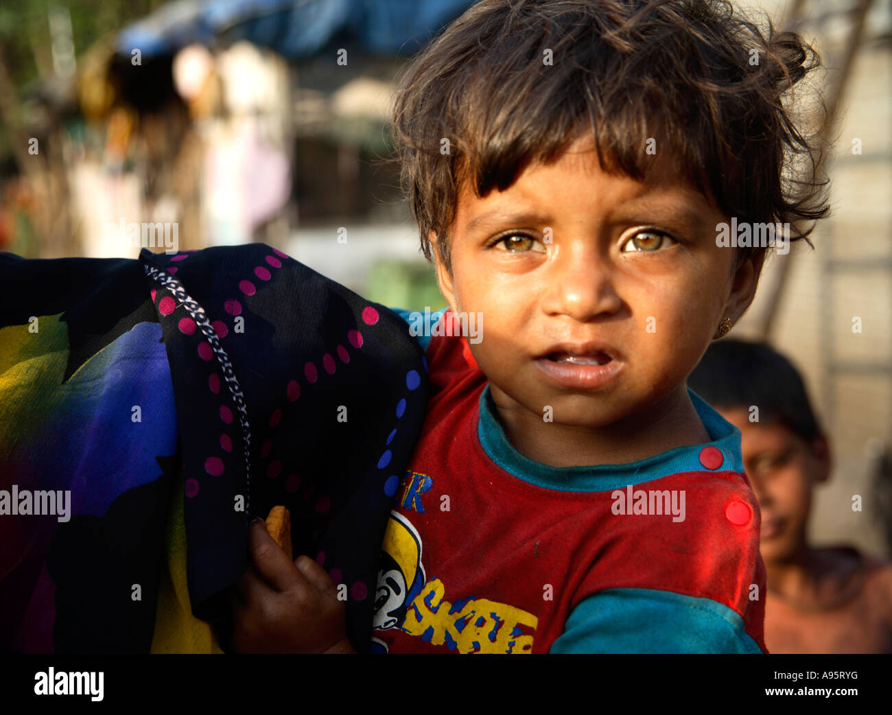 Young Indian boy posing outside shanty home, D'Mello Road, Mumbai, India Stock Photo - Alamy