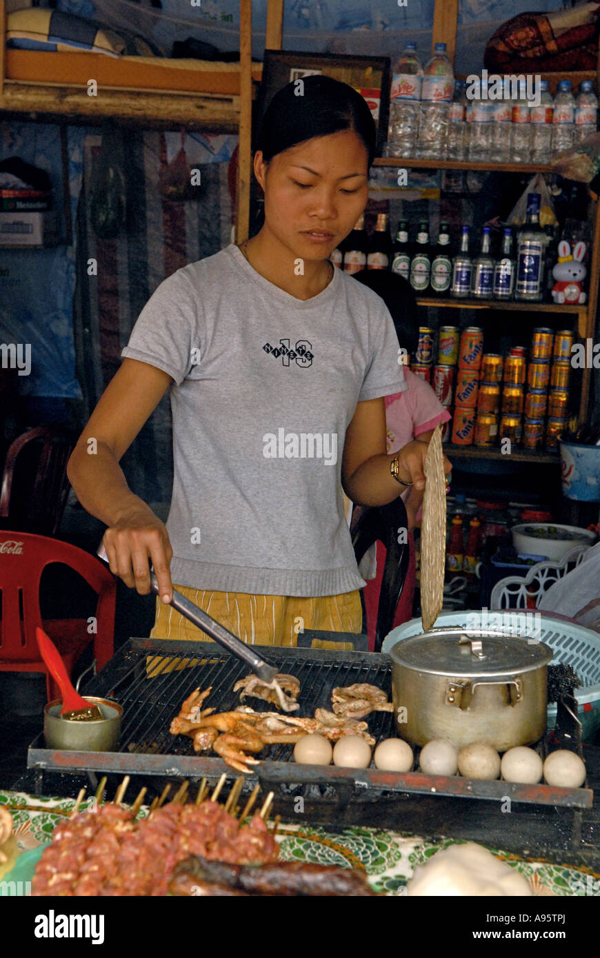 Vietnamese girl cooking hi-res stock photography and images - Alamy