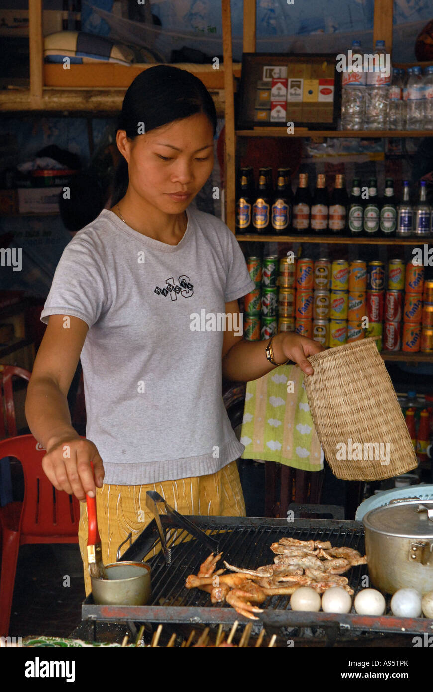 Lady cooking in a small restaurant Sapa town Vietnam Stock Photo - Alamy