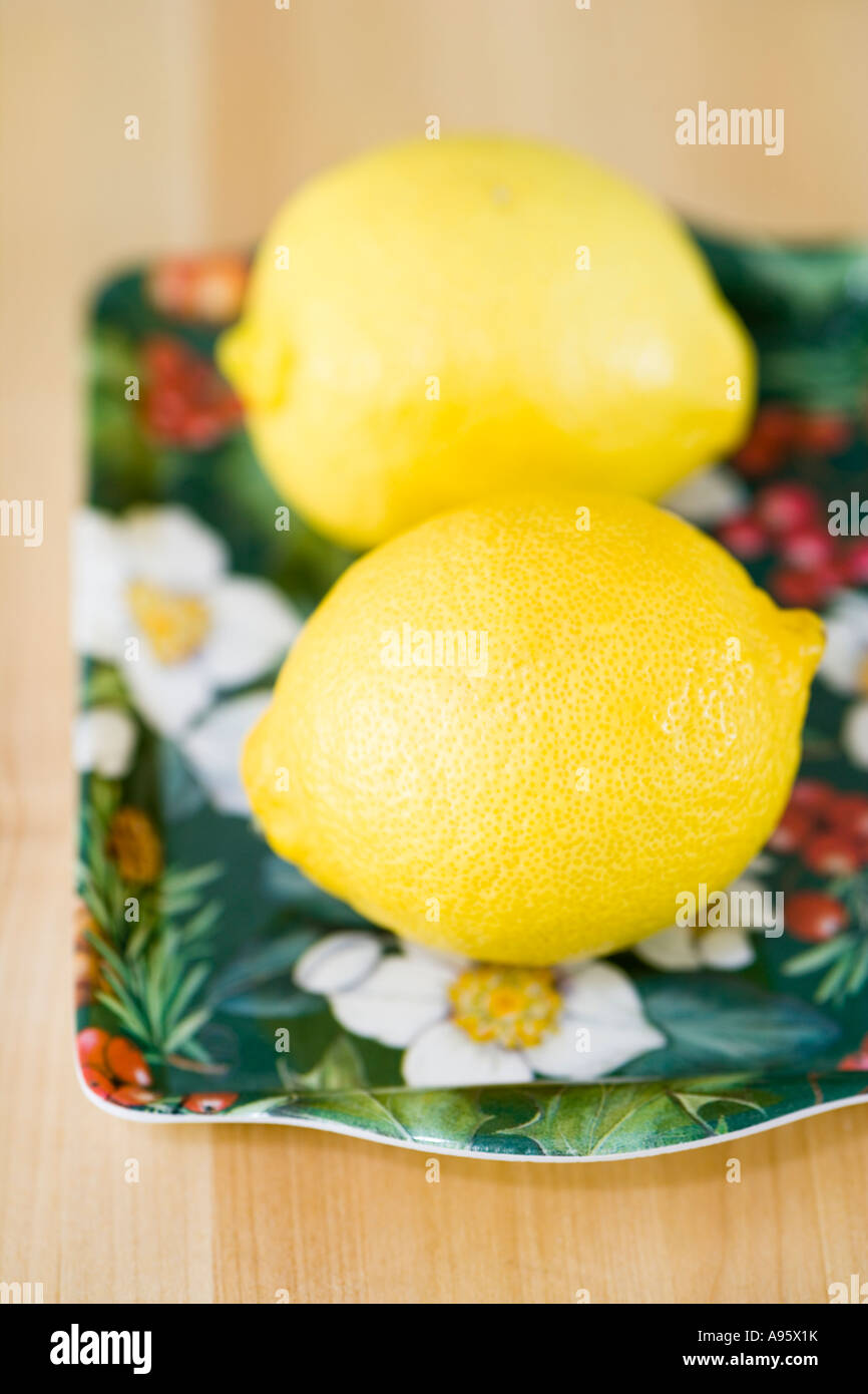 Lemons on plate Stock Photo - Alamy