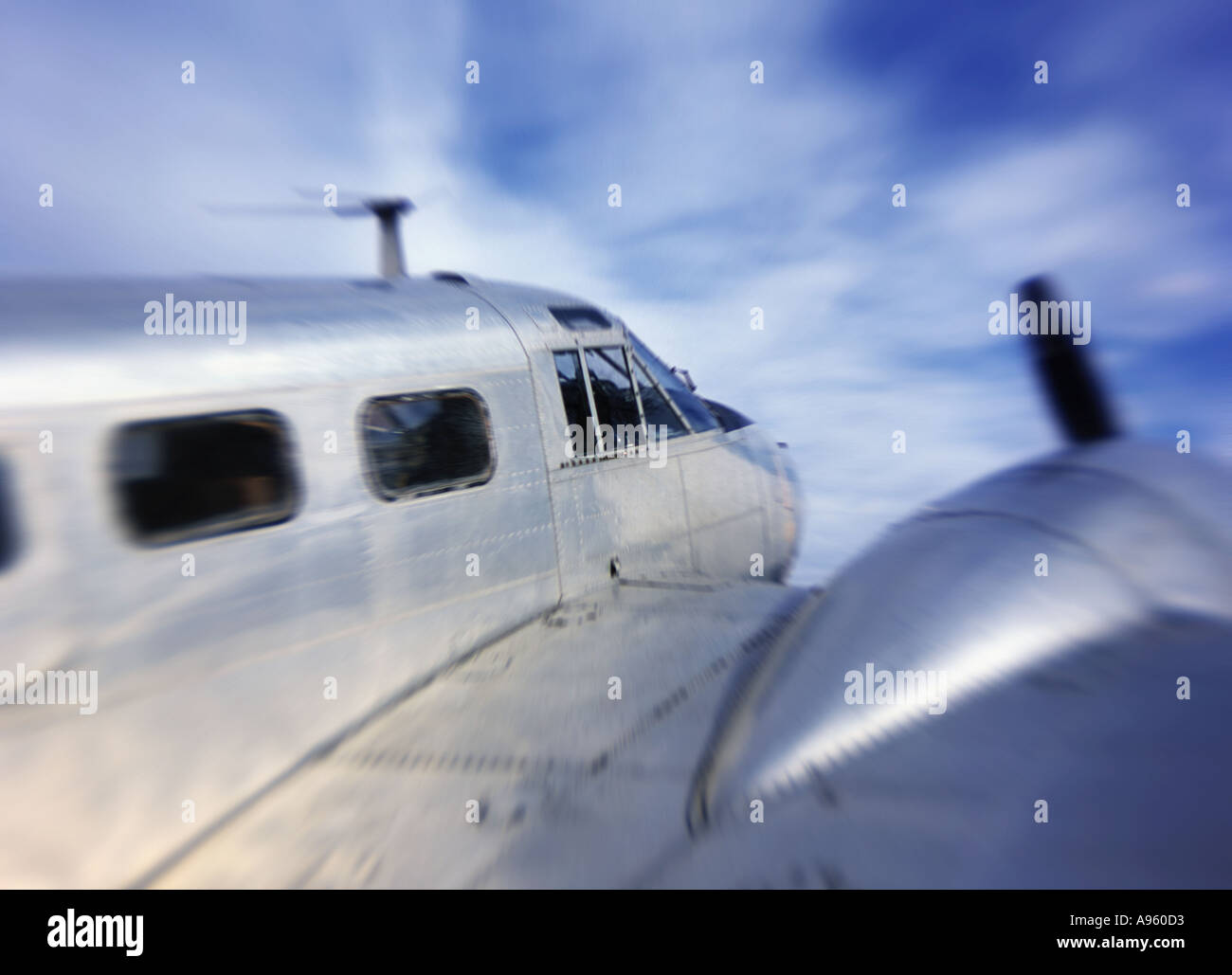 Vintage twin engine plane flying Stock Photo - Alamy