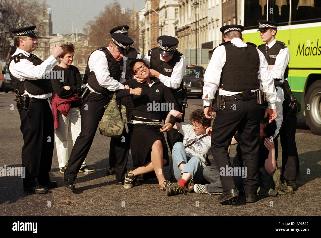 Police remove and arrest students taking part in a sit down protest ...