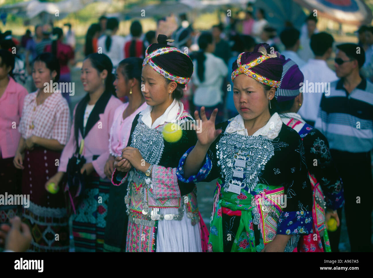Hmong girls in traditional costume at courting ceremony, Thalat, Lao ...