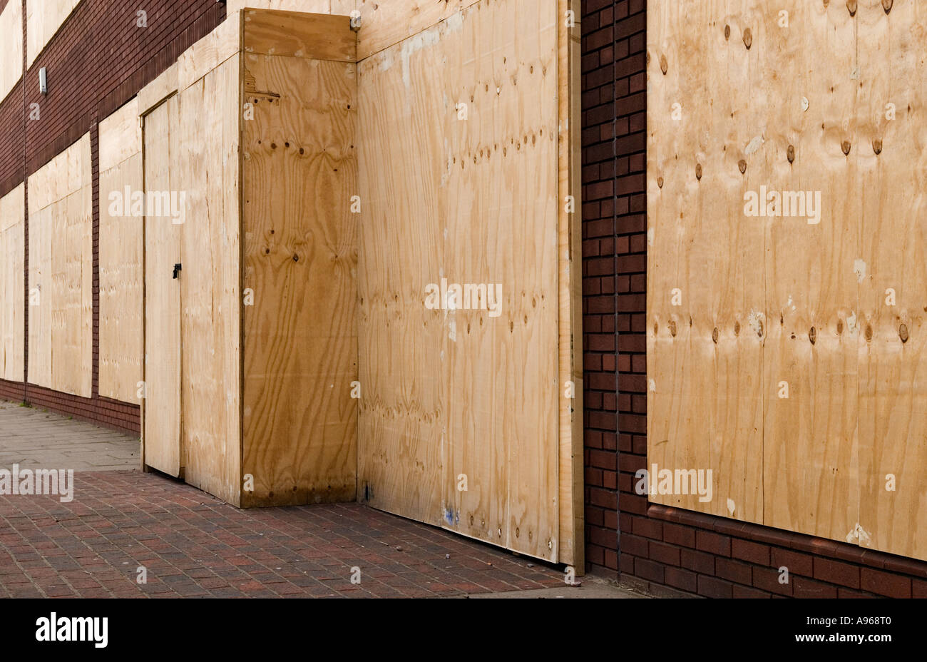 Boarded up modern red brick building Kiings Road Chelsea, London SW3 ...
