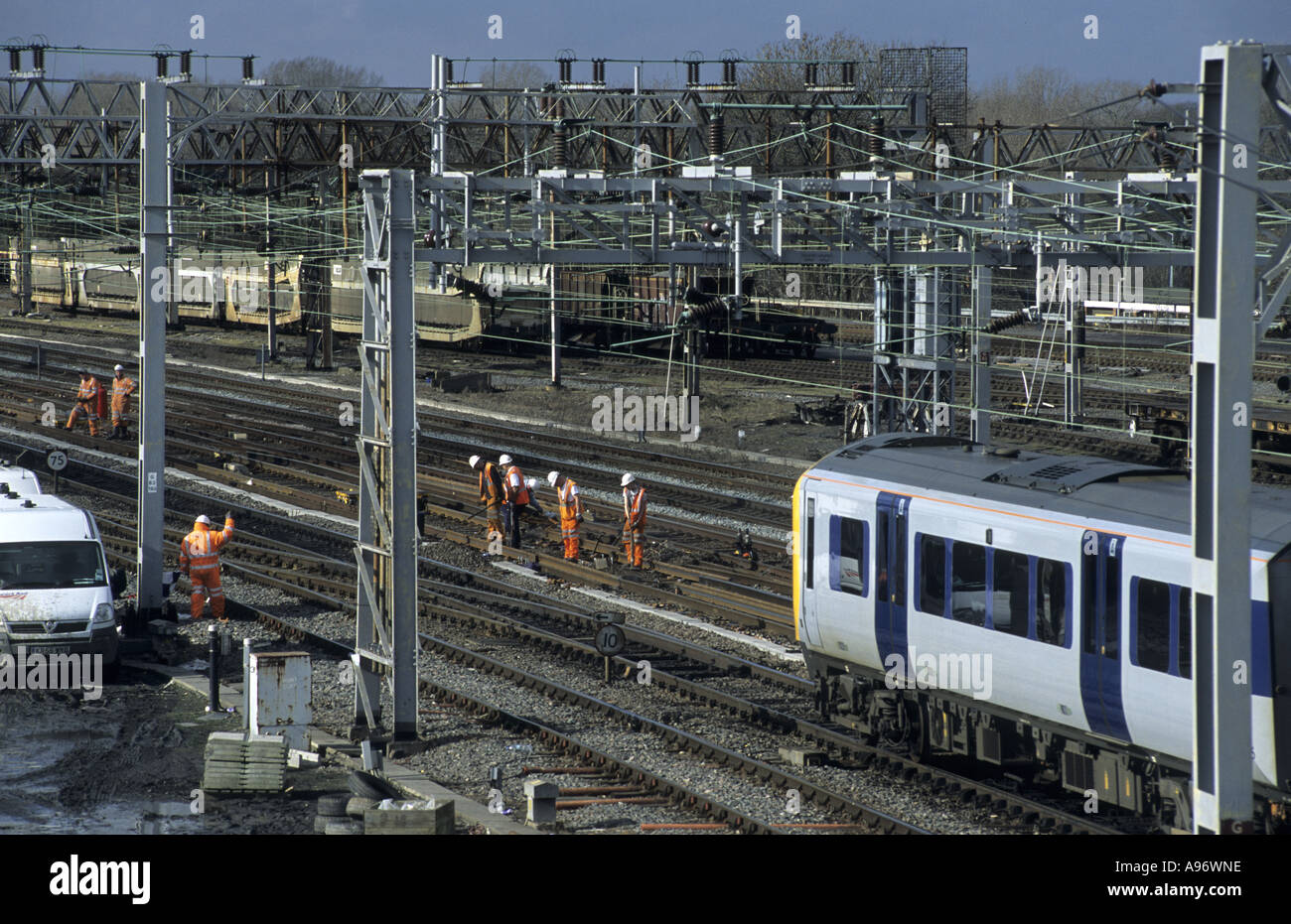 Central Trains Desiro train passing Network Rail track workers at Rugby ...