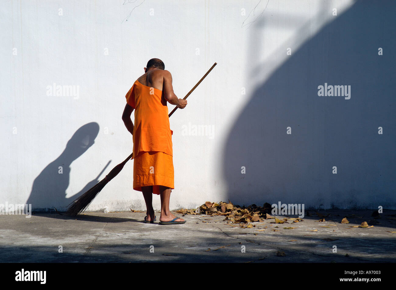 Buddhist Monk Sweeping Leaves High Resolution Stock Photography and ...