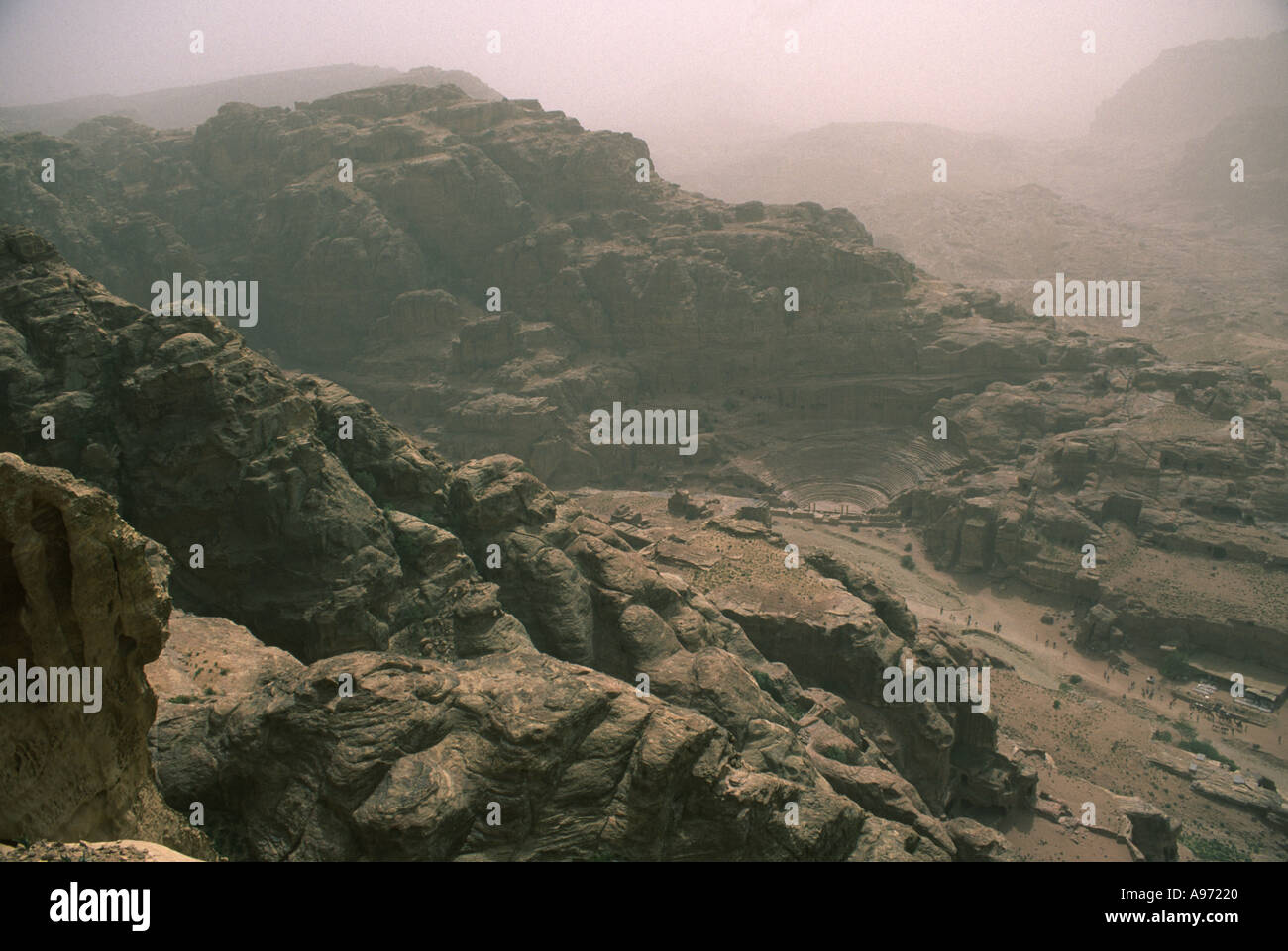 Roman theatre from Jabal al Khubtha in sandstorm Petra Jordan Stock ...