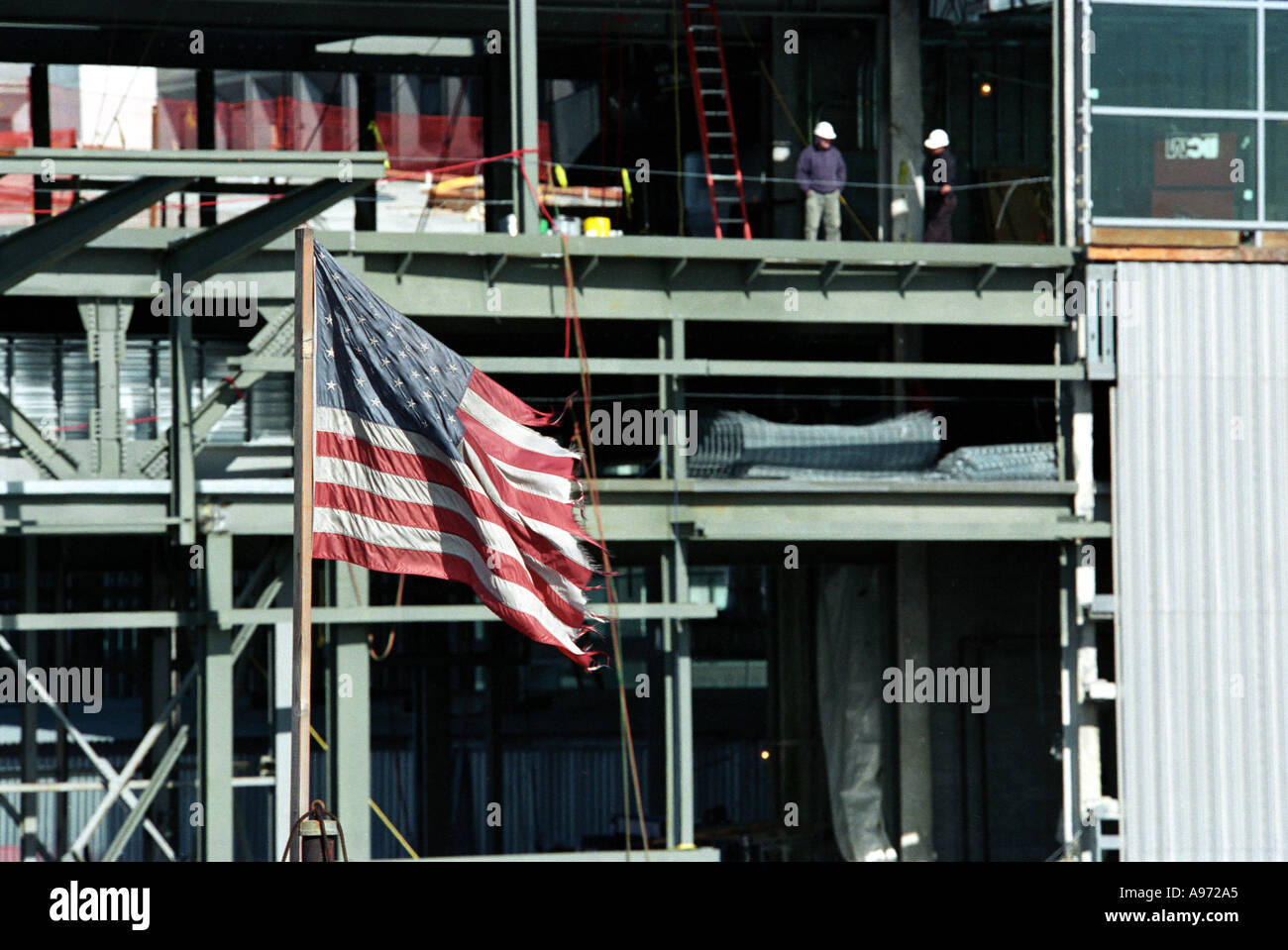 American flag waving over the construction area in New York Stock Photo ...
