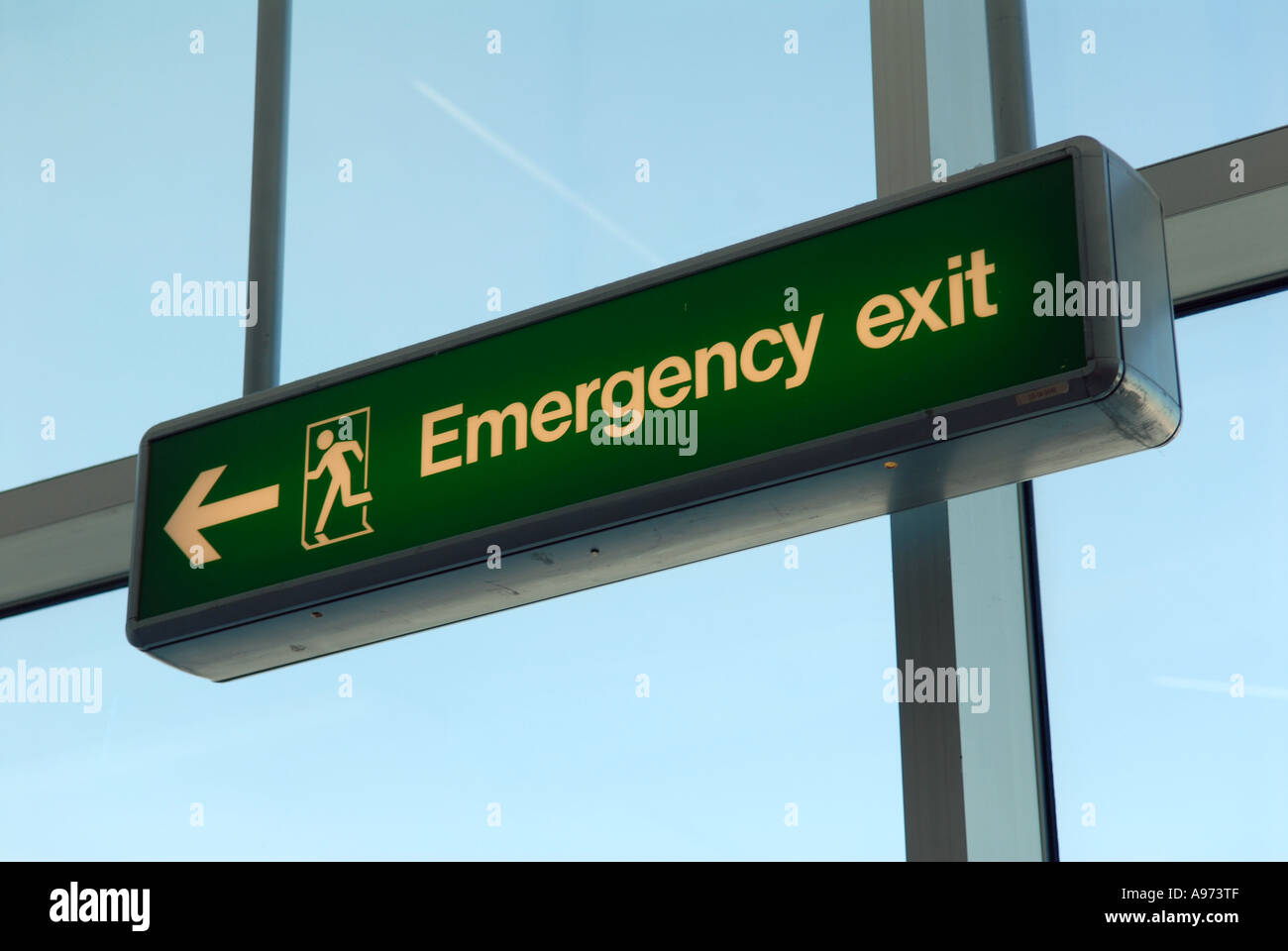 Emergency exit sign, Gatwick airport Stock Photo - Alamy