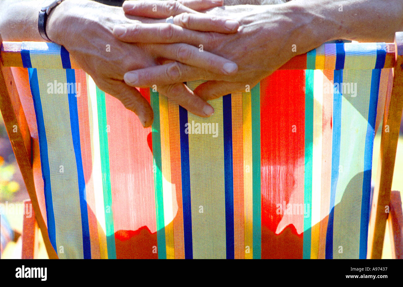 Backlit Man Resting in Deckchair in strong sunshine Stock Photo - Alamy