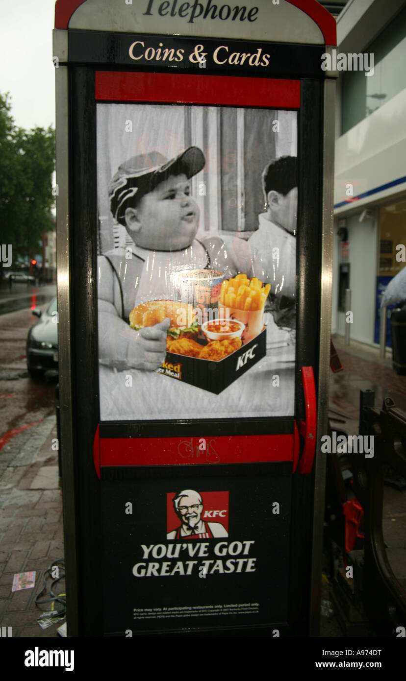 Protest poster against fatty food on the side of a phone box Brick Lane ...
