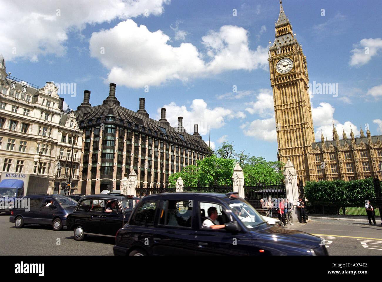 A London Taxi passes Big Ben and the Houses of Parliament London ...