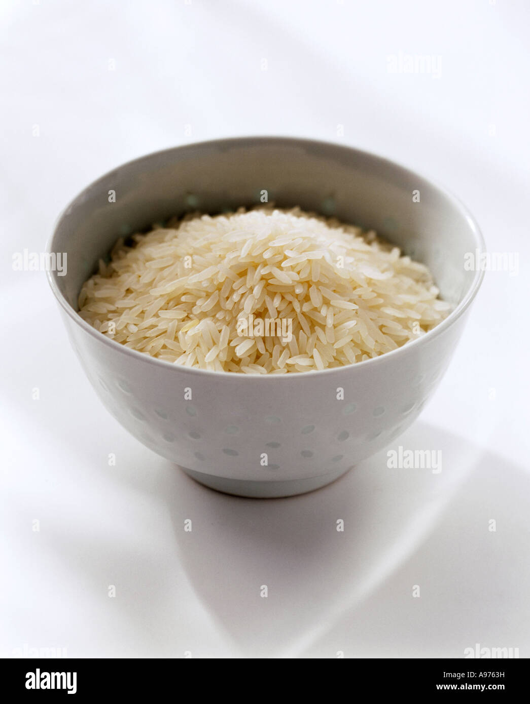 A Bowl of Uncooked White Rice FoodCollection Stock Photo - Alamy