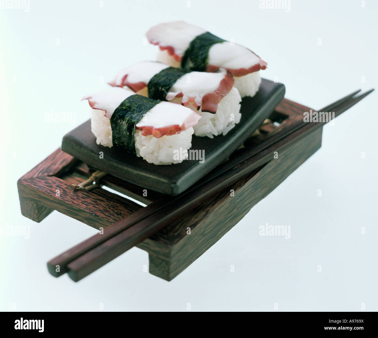 Three Maki Tako Sushi on a Japanese Box FoodCollection Stock Photo - Alamy