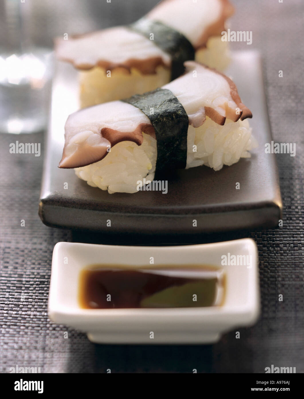 Two Maki Tako Sushi with Dipping Sauce FoodCollection Stock Photo - Alamy